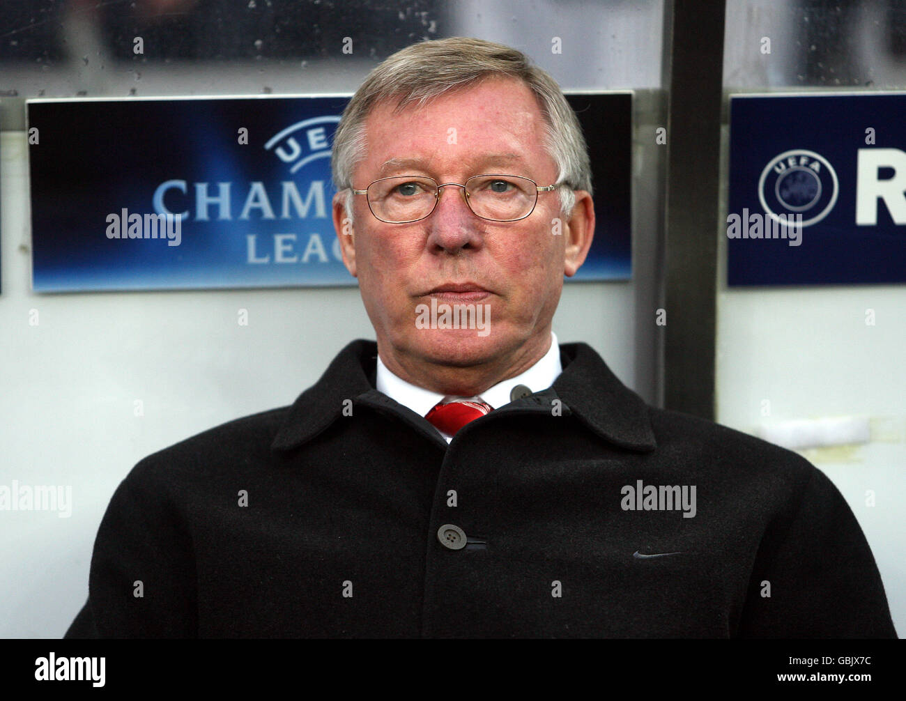 Manchester united manager sir alex ferguson on the bench hi-res stock ...