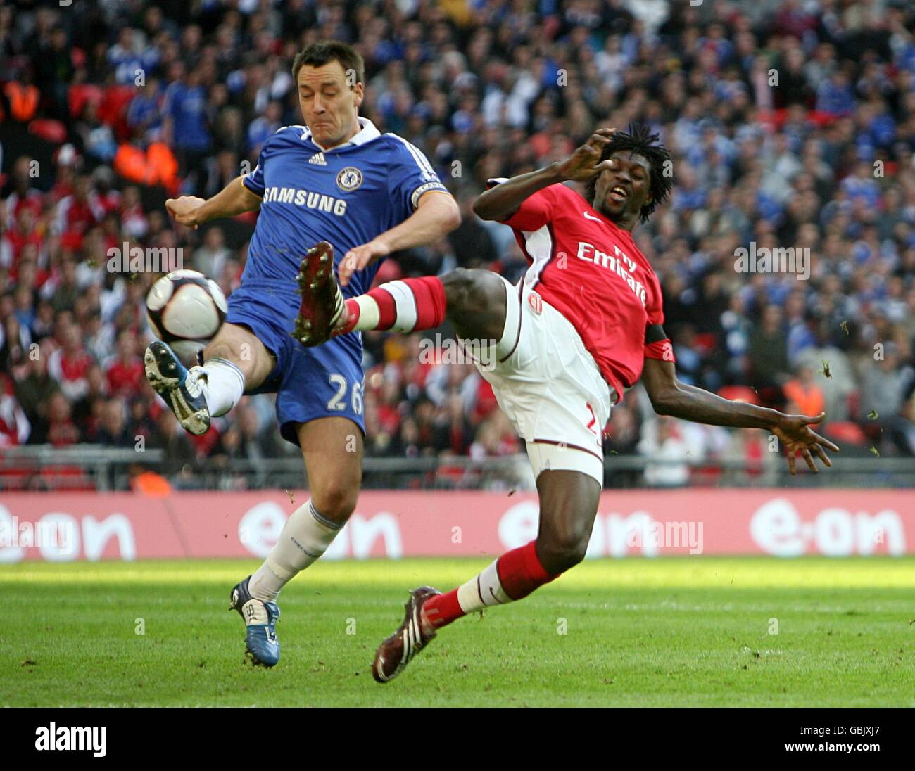 Arsenal's Emmanuel Adebayor (right) and Chelsea's John Terry battle for ...