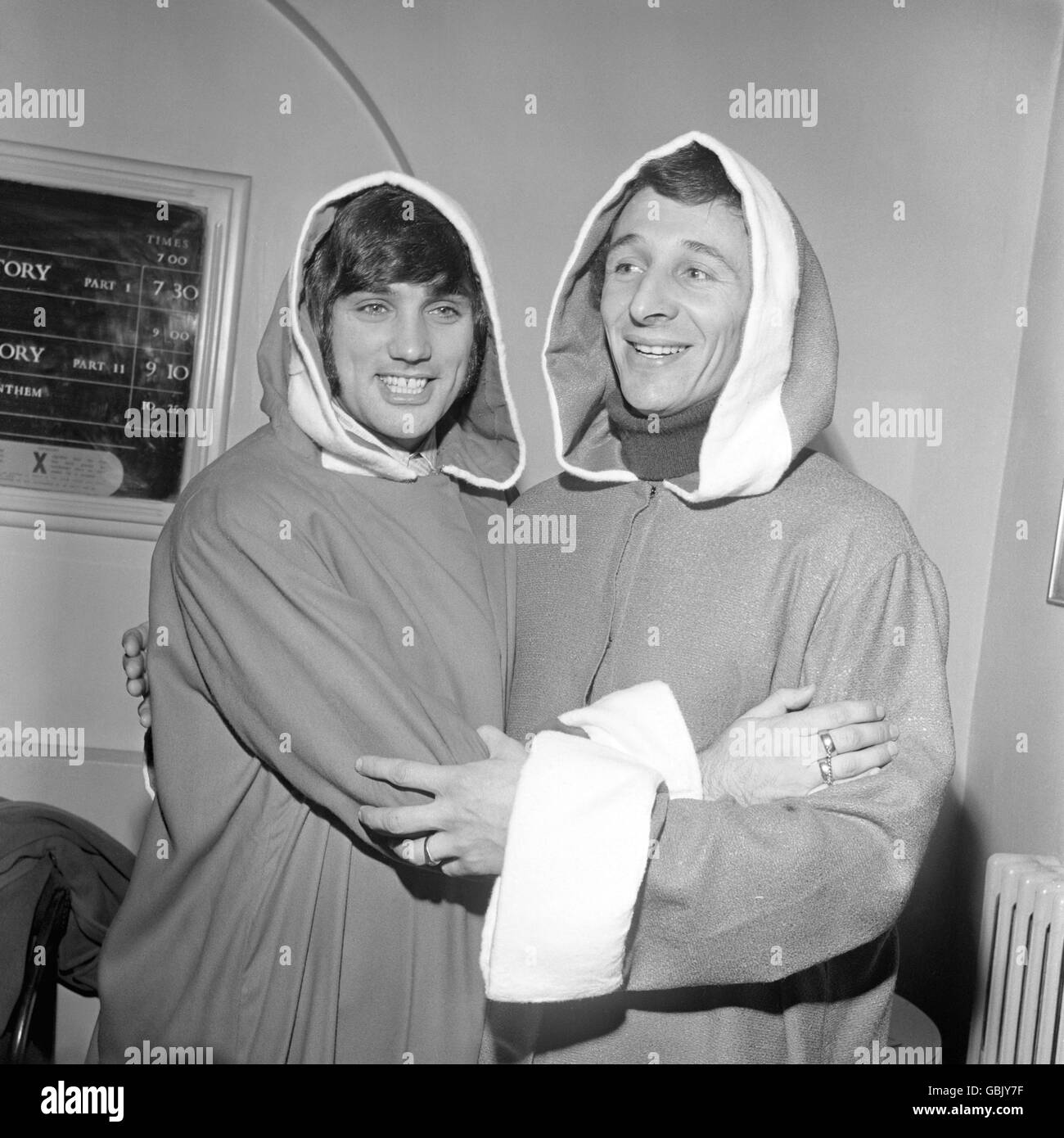 (L-R) George Best and Mike Summerbee get into the Christmas spirit ...