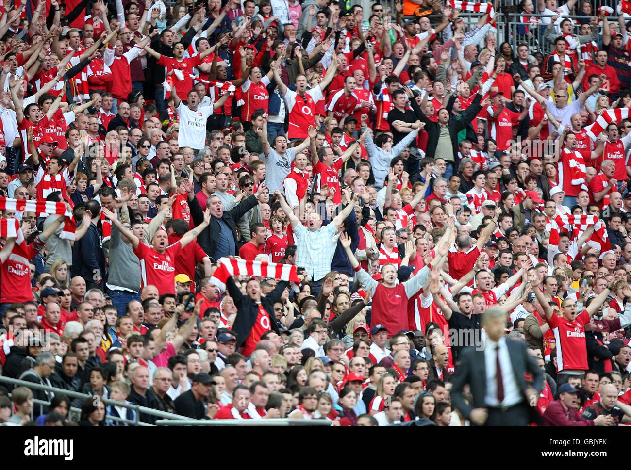 Arsenal fans celebrate in the stands hi-res stock photography and ...