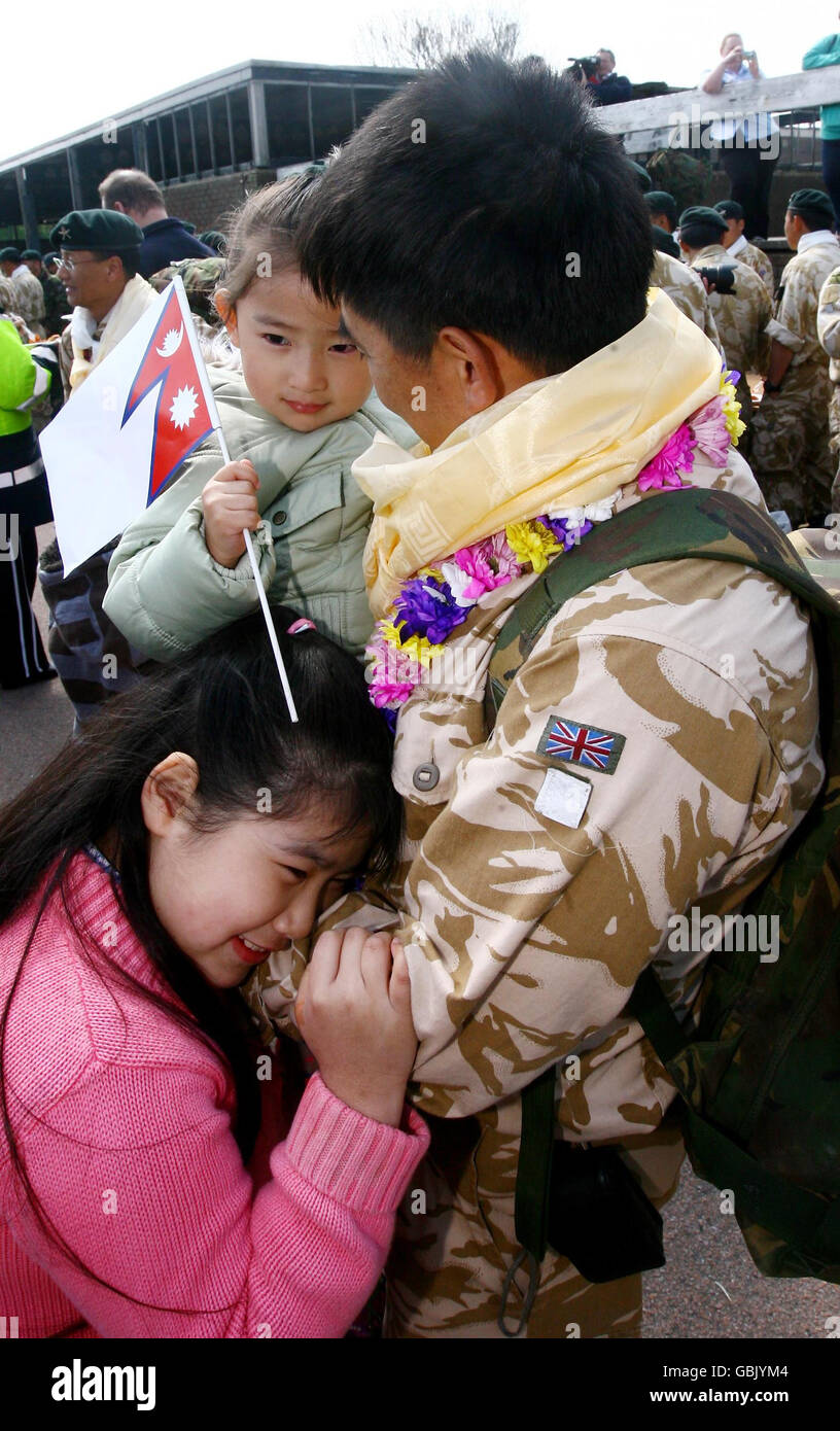 Colour Sergeant David Rai greets his daughters Sweta (top) who is three ...