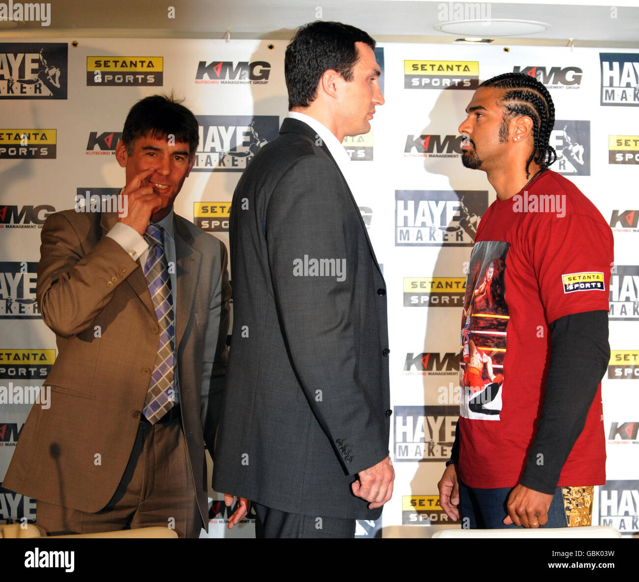 Paul Dempsey (left) makes a face as he tries to break up a staring ...