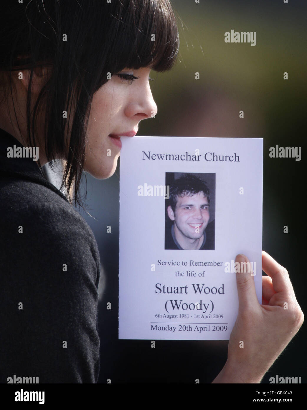 A mourner arrives at the funeral of 27-year-old Stuart Wood who died in ...