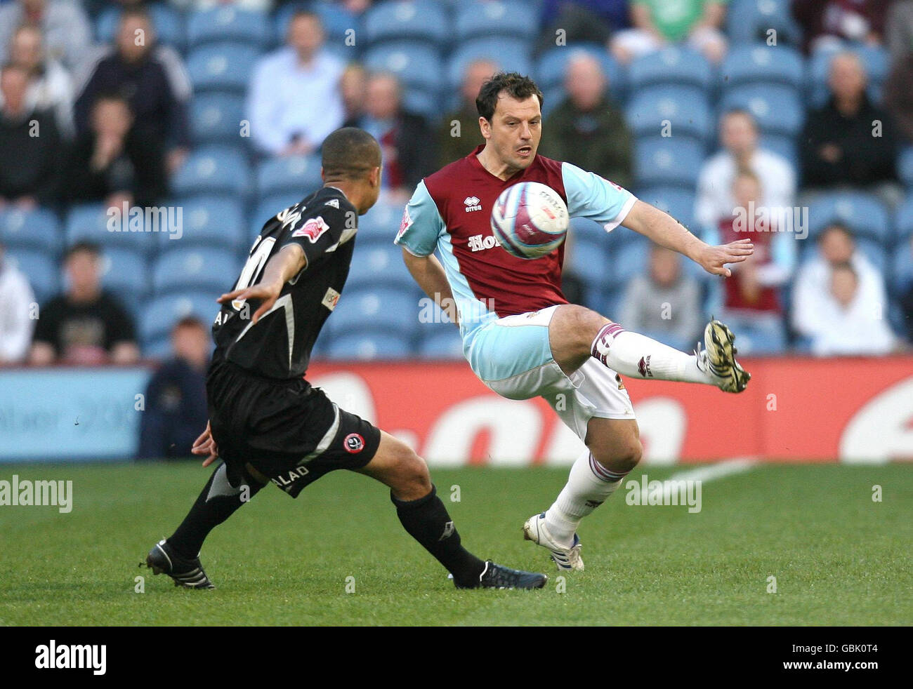 Burnley's Robbie Blake battles and Sheffield United's Kyle Naughton ...
