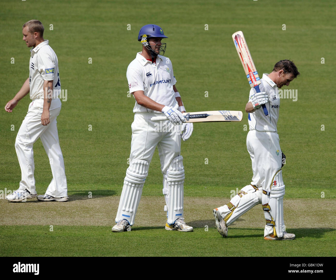 Cricket batsman raising bat hi-res stock photography and images - Alamy