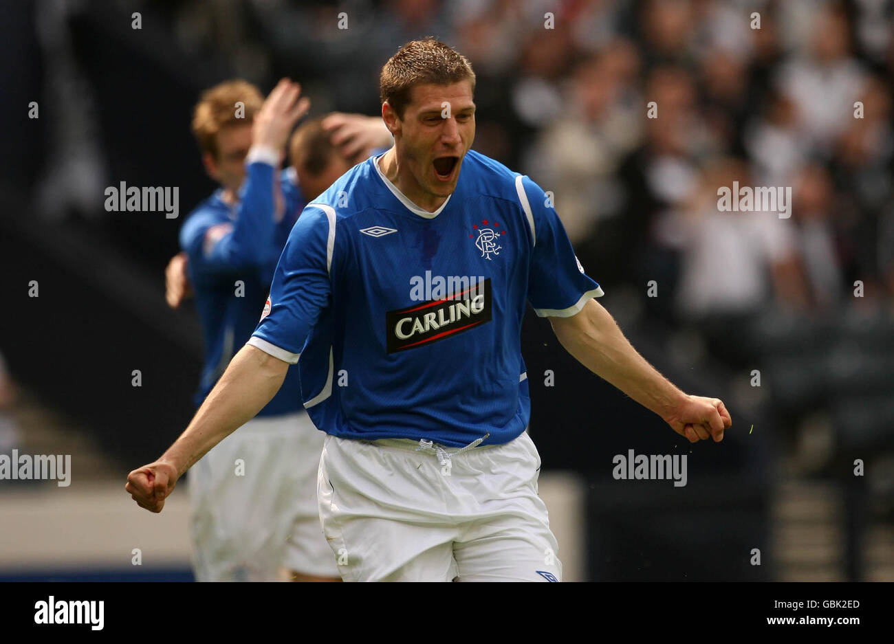 Glasgow rangers players celebrate goal hi-res stock photography and ...