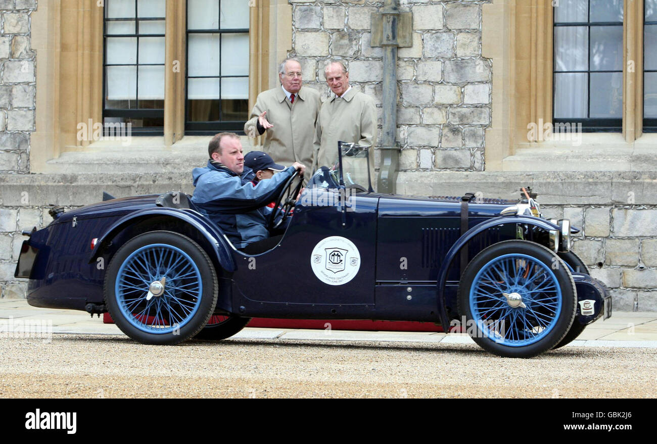 The Duke of Edinburgh and car specialist Graham Robson (left) view a MG ...