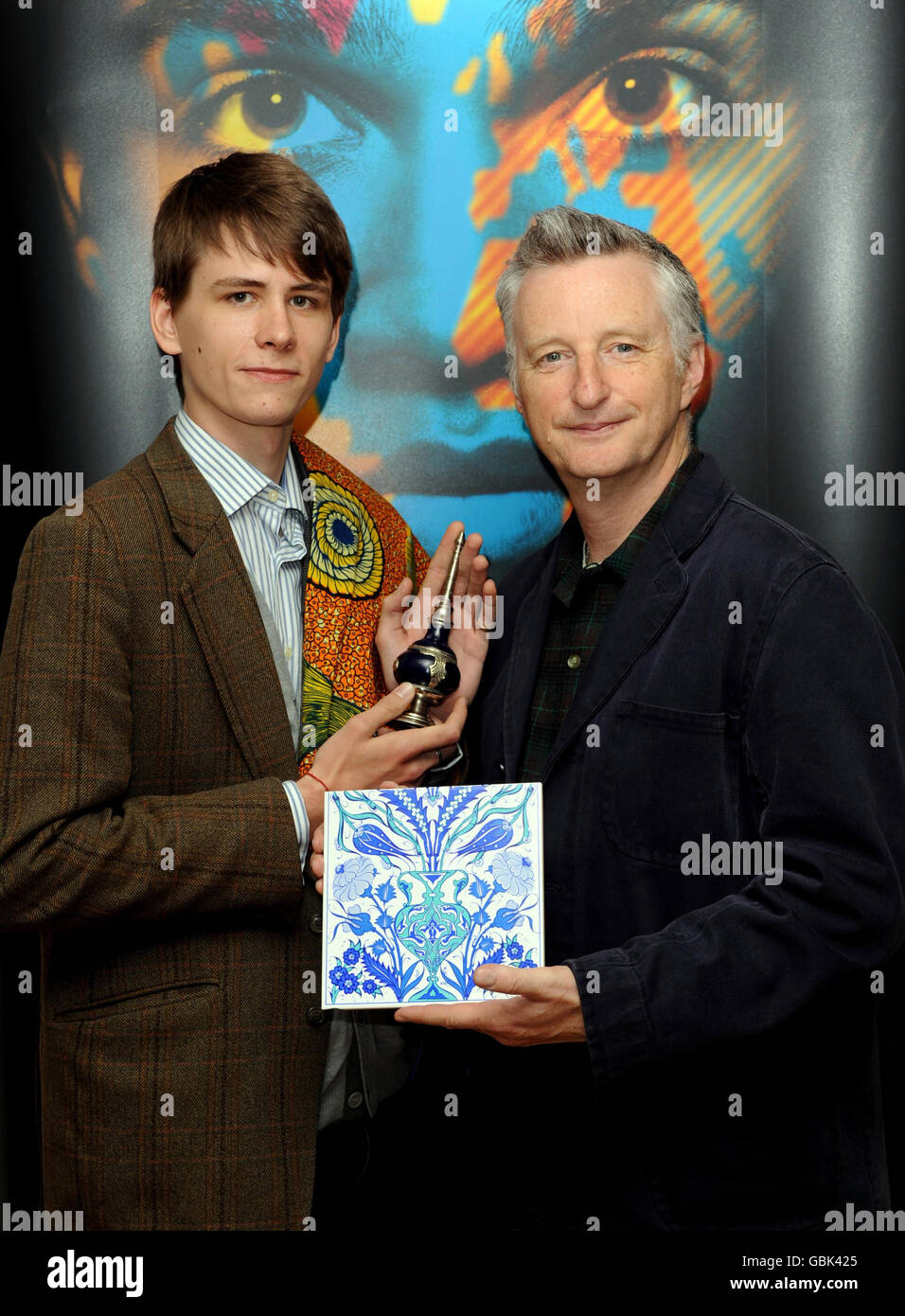 Billy Bragg (right) holding a ceramic tile and Simon Cantrill from ...
