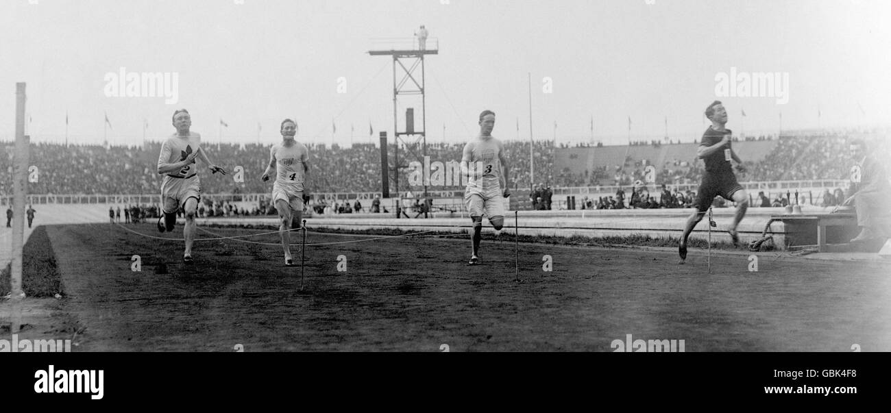 South Africa's Reggie Walker (r) breaks the tape to win gold from USA's ...
