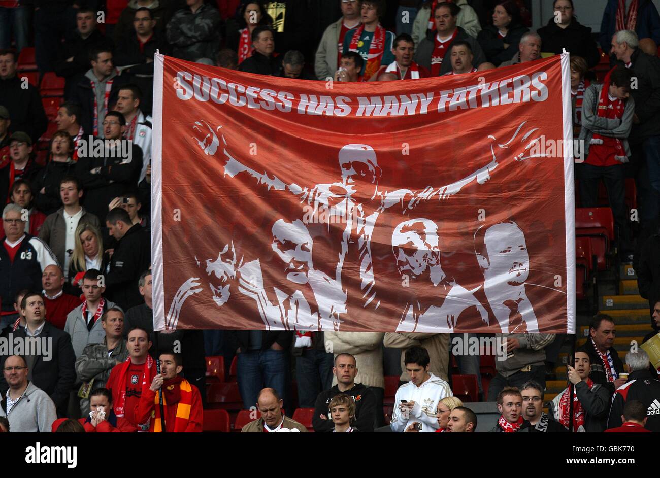 Liverpool fans with a success has many fathers banner hi-res stock ...