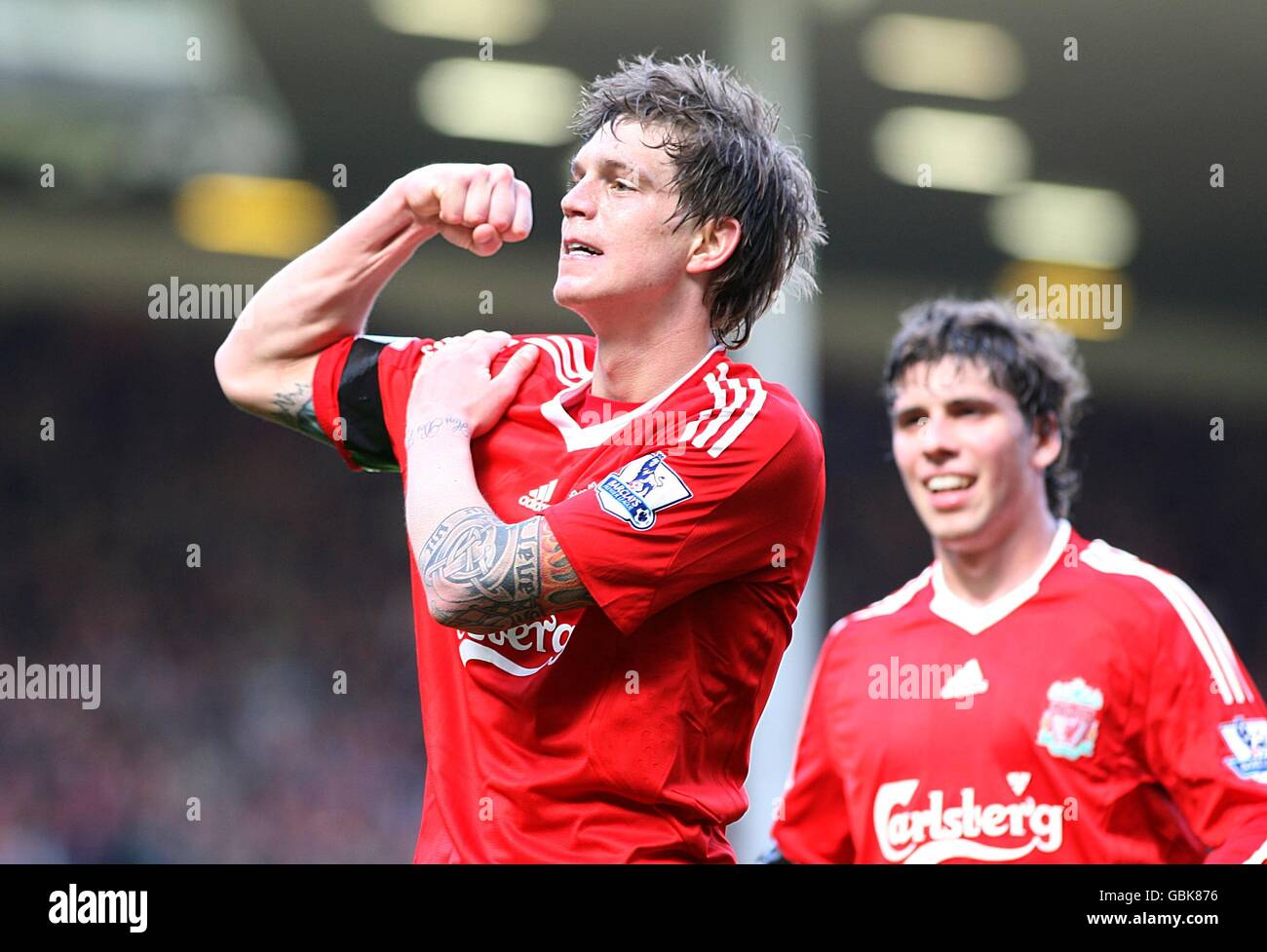 Liverpool's Daniel Agger celebrates after scoring the third goal of the ...