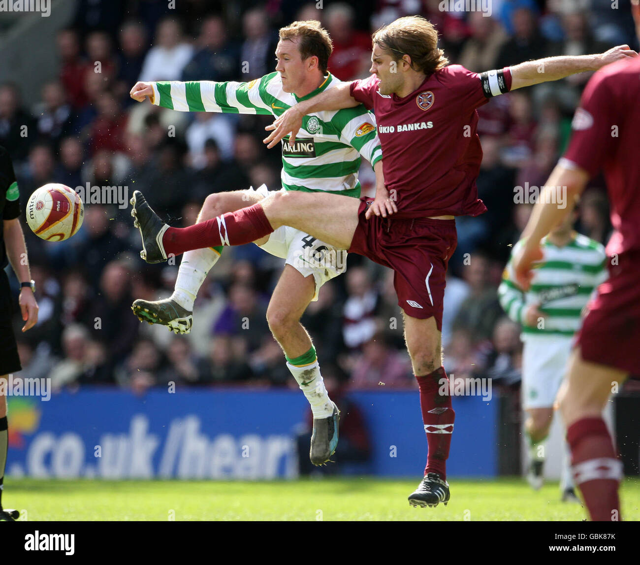 Celtic's Aiden McGeady (left) and Hearts' Robbie Neilson battle for the ...