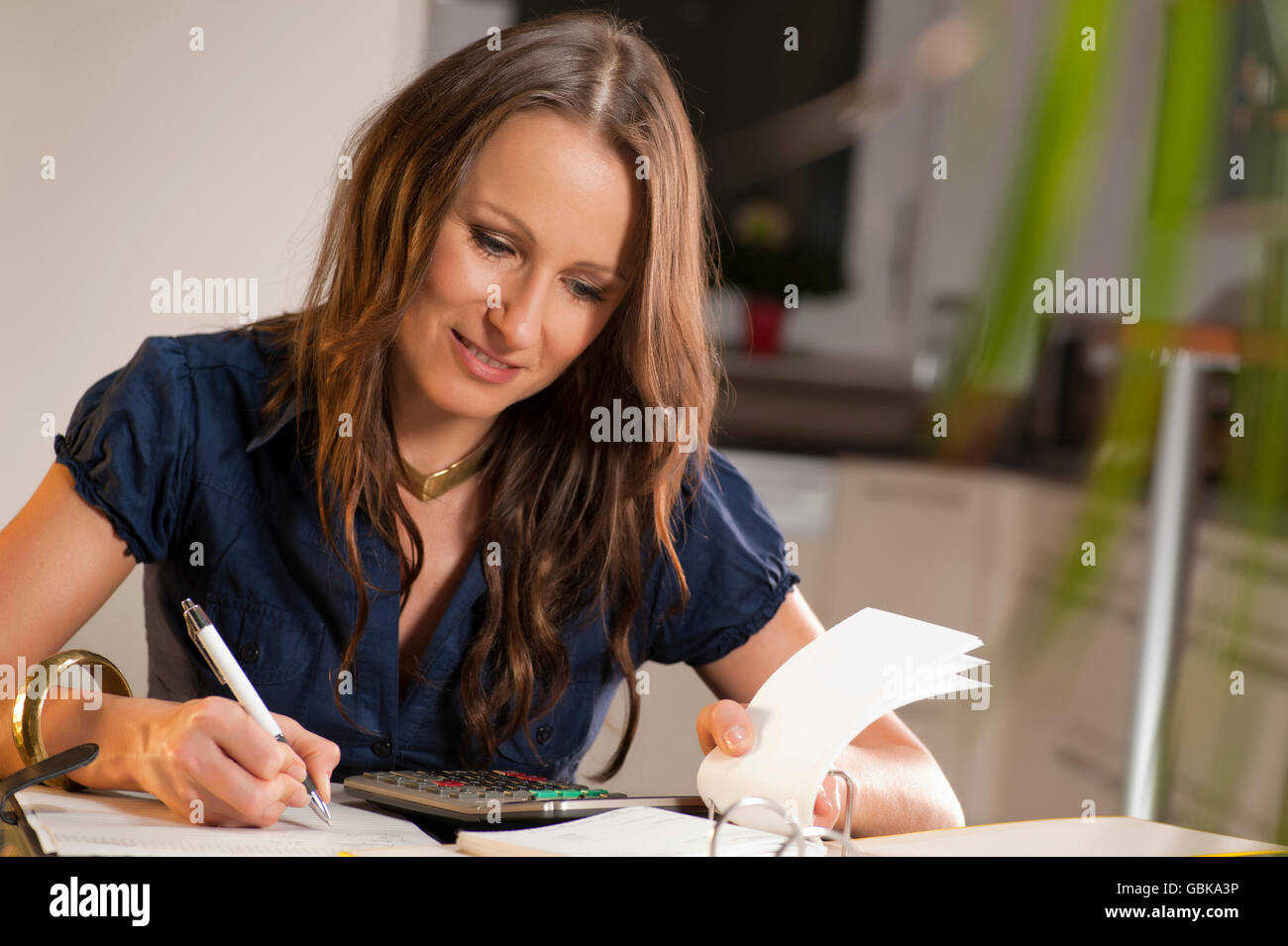 Young woman controlling her finances Stock Photo - Alamy