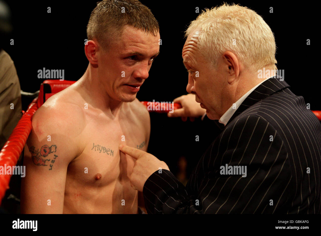 Promoter Frank Maloney (right) talks to boxer Jason Booth (left) after ...
