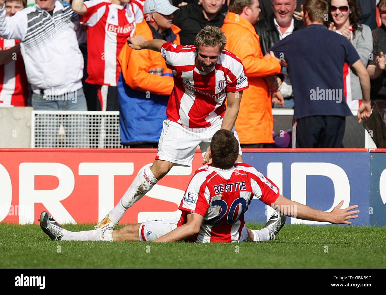 Stoke City's Liam Lawrence (standing) celebrates scoring the opening ...
