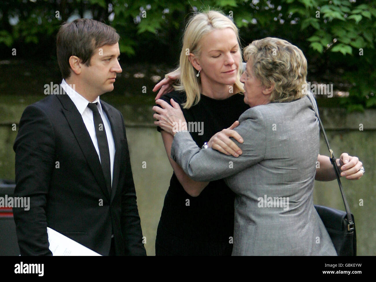 Widow of Sir Clement Freud, Jill Freud (right), is comforted by ...