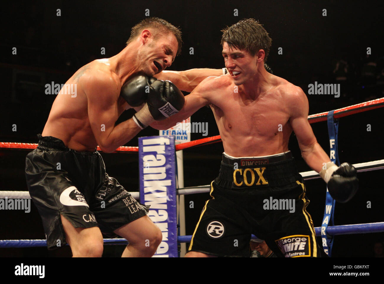 Jamie Cox (right) lands a shot on Mark Lloyd's chin during the final ...