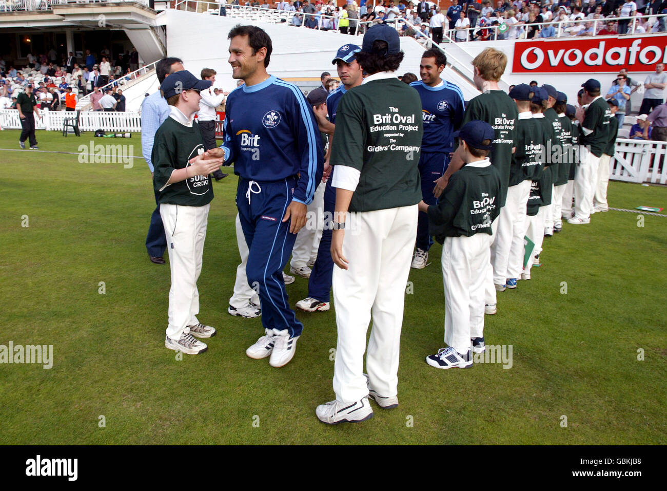 The Surrey Colts line up to form a walk way for the players coming out ...