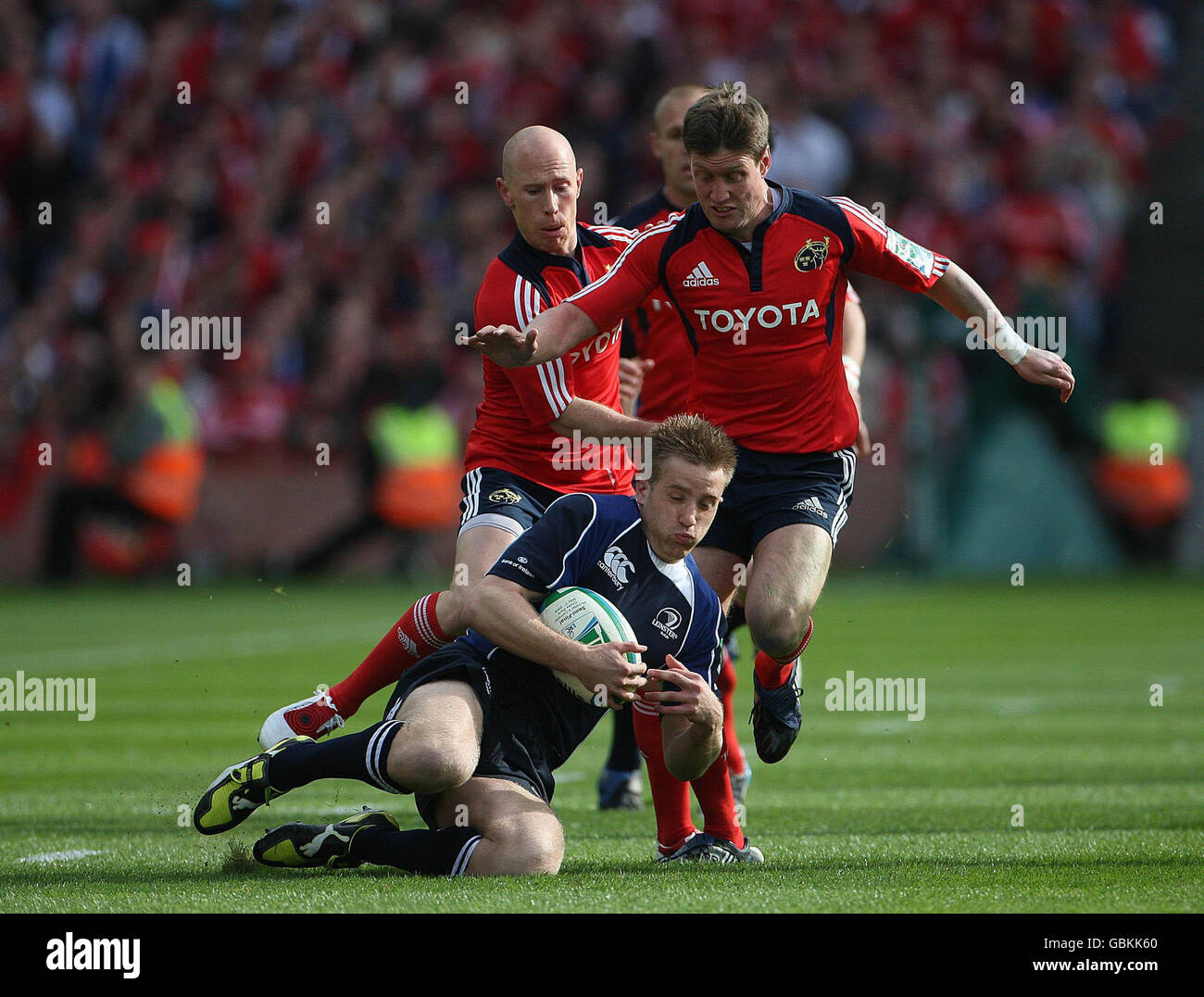 Munsters Ronan O'Ggara and Peter Stringer and Leinsters' Luke ...