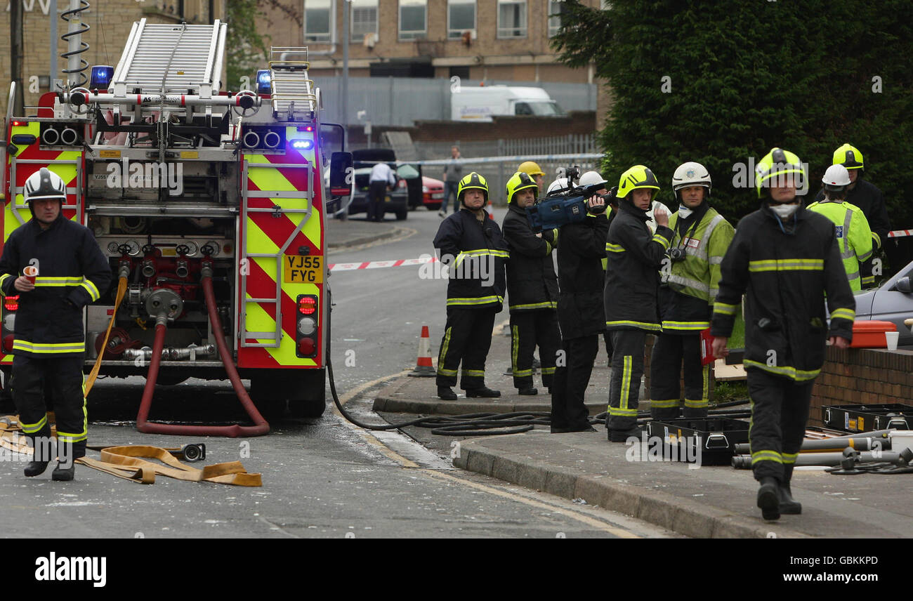 Fire officers work outside a pie factory in Huddersfield where one ...