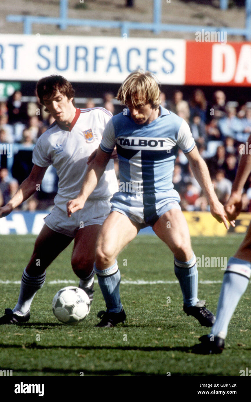 Coventry City's Brian Roberts (r) shields the ball from West Ham United ...