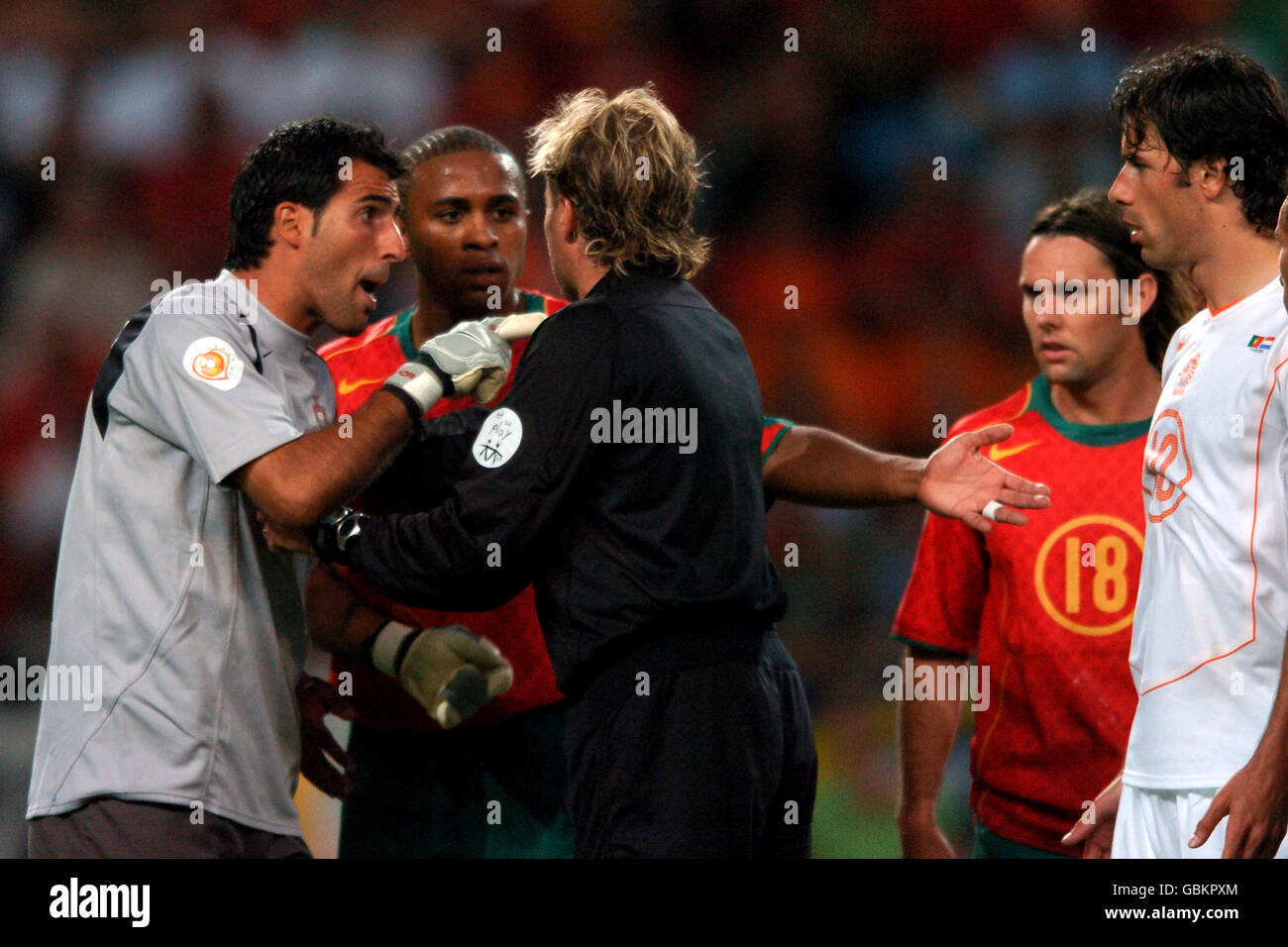 Portugal goalkeeper Ricardo (l) appeals to referee Anders Frisk after a ...