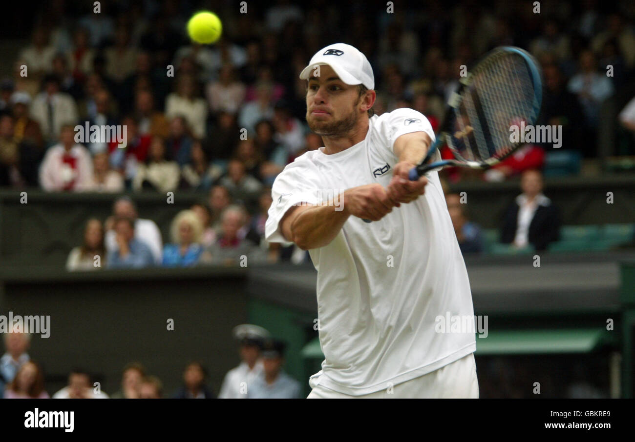 Andy roddick places shot down the line against roger federer hi-res ...