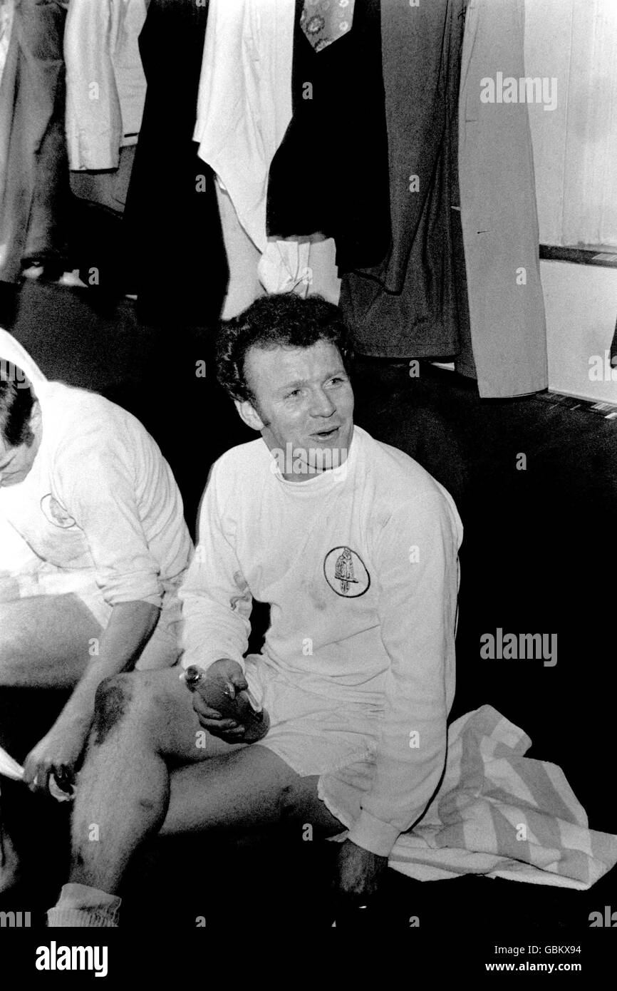 Leeds United's Billy Bremner has a celebratory drink in the dressing ...