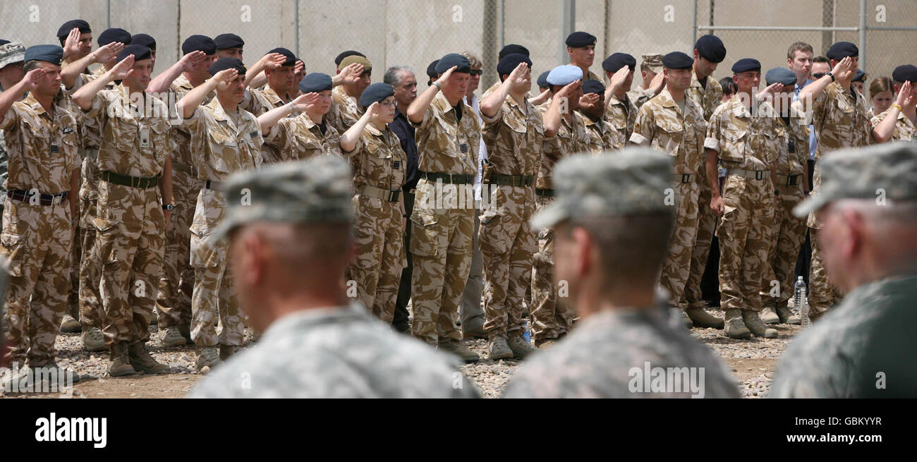 British soldiers salute at the memorial wall front of 20th Armoured ...