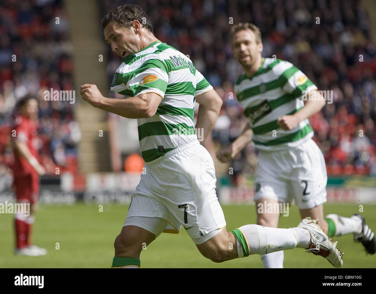 Celtic striker Scott McDonald celebrates scoring during the Clydesdale ...