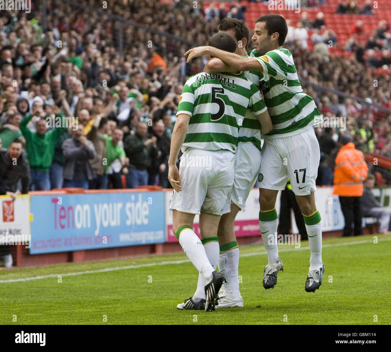 Celtic players celebrate with Gary Caldwell after his headed ball is ...