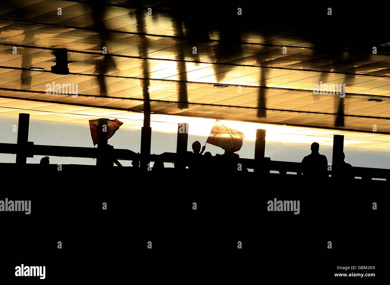 Arsenal fans wave flags in stands hi-res stock photography and images ...