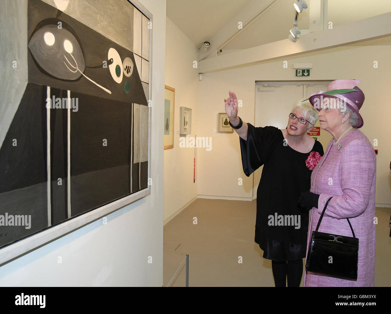 Queen Elizabeth II speaks with Arts Officer Deirdre Quail at the ...