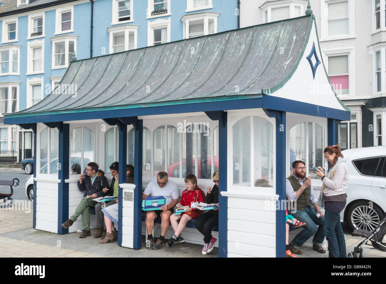 Family eating take away,take out fish and chips from local chippy at ...