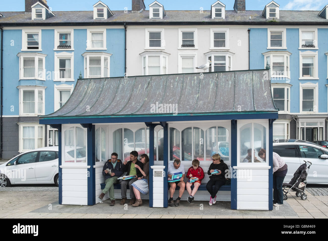 Family eating take away,take out fish and chips from local chippy at ...
