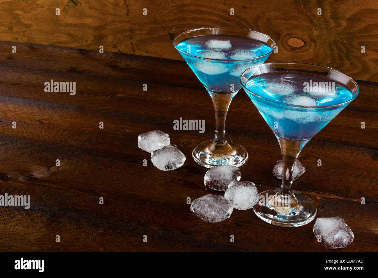 Blue cosmopolitan cocktail with ice. Blue margarita. Blue cosmopolitan ...