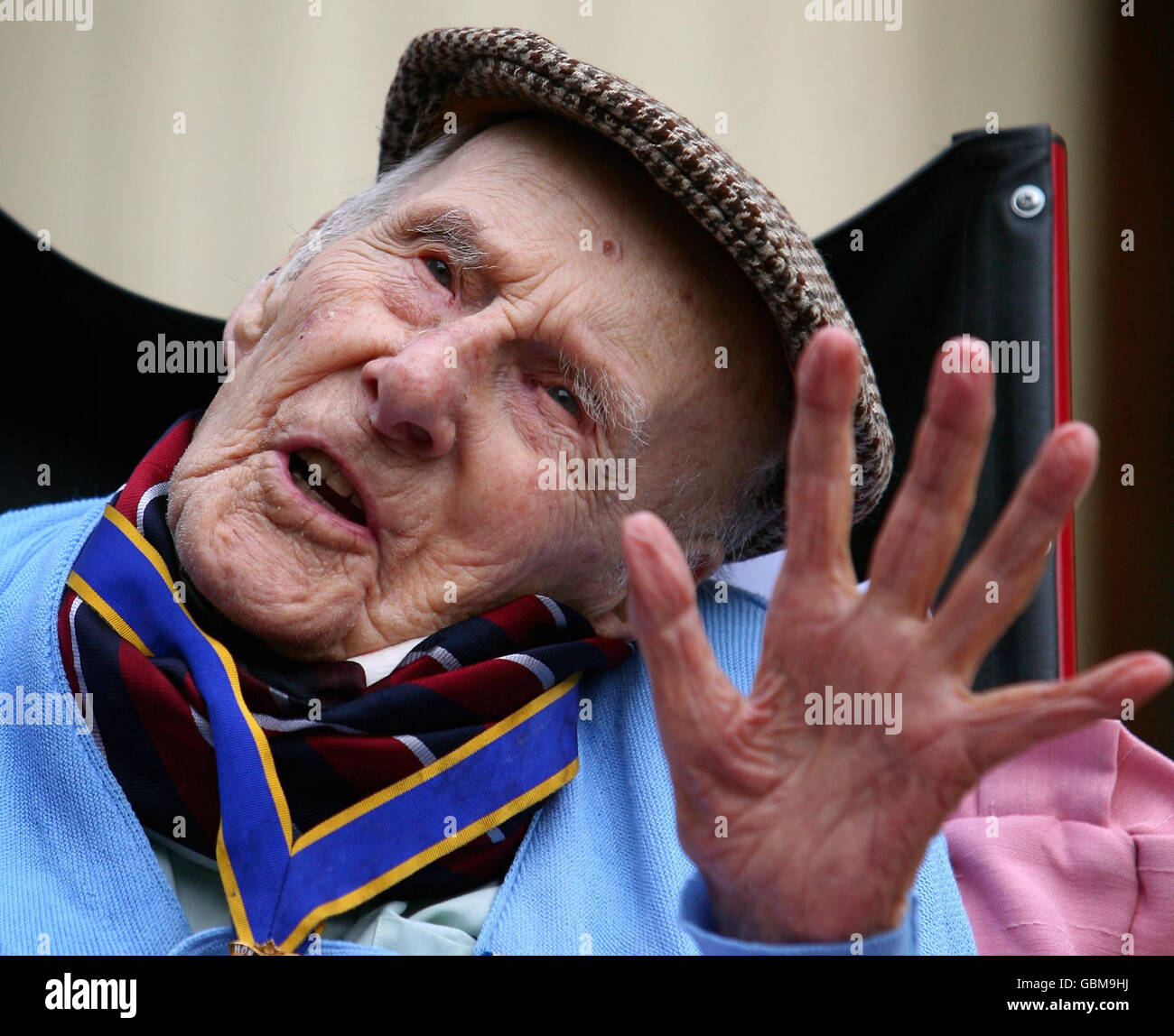 Alternate crop. Henry Allingham waves goodbye after being made an ...