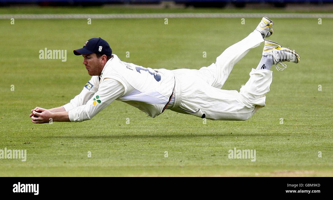 Essex's Tim Philipps takes the catch of James Hockley during the ...