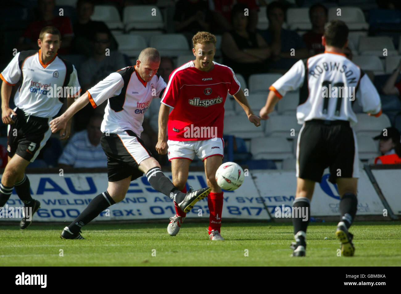 Charlton Athletic's Dennis Rommedahl has the ball tacken off him by ...