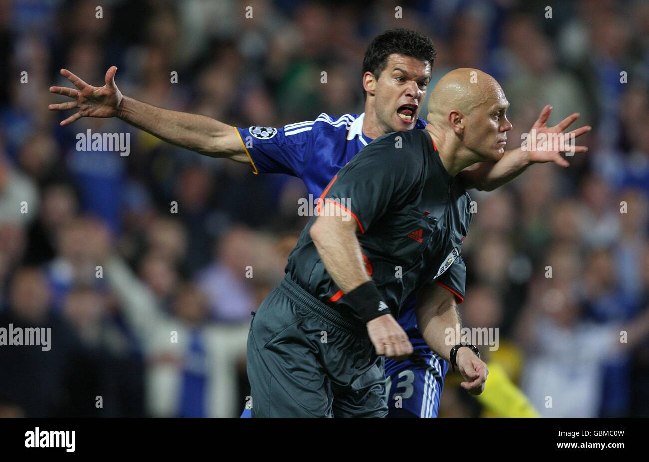 Chelsea's Michael Ballack (left) shouts at referee Tom Ovrebo (right ...