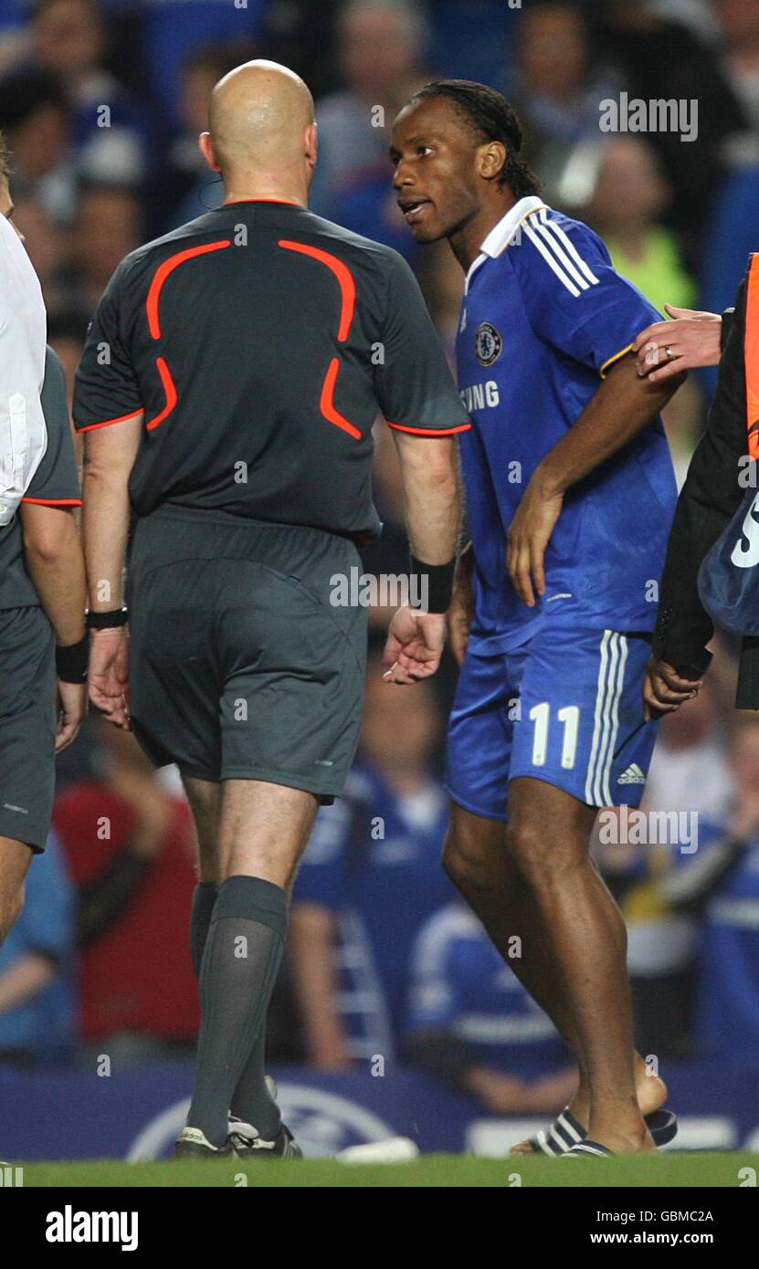 Chelsea's Didier Drogba (right) shows his frustration towards referee ...