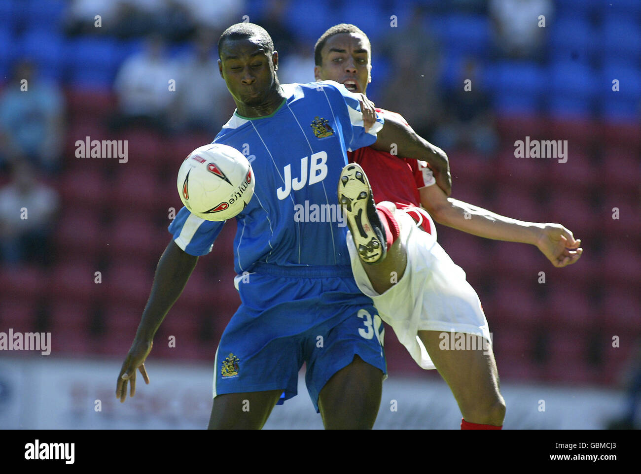 Wigan Athletic's Jason Roberts and Nottingham Forest's James Perch ...