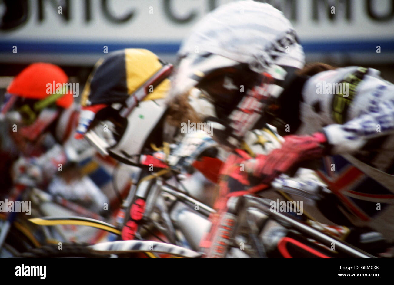 SPEEDWAY RIDERS ACCELERATE FROM THE START LINE BLURRED ACTION Stock ...