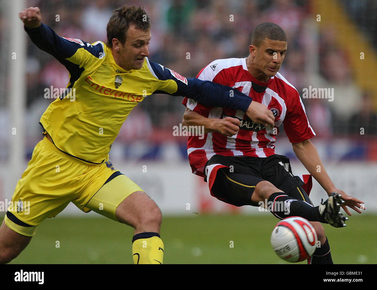Sheffield United's Kyle Walker holds off a challenge from Preston North ...