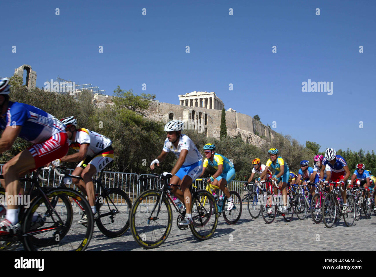 Cyclists make their way past the Acropolis in Athens during the Men's ...