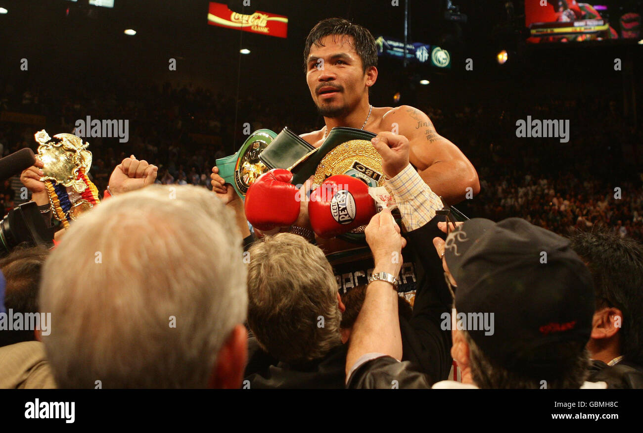 Manny Pacquiao is held aloft after beating Ricky Hatton during the ...