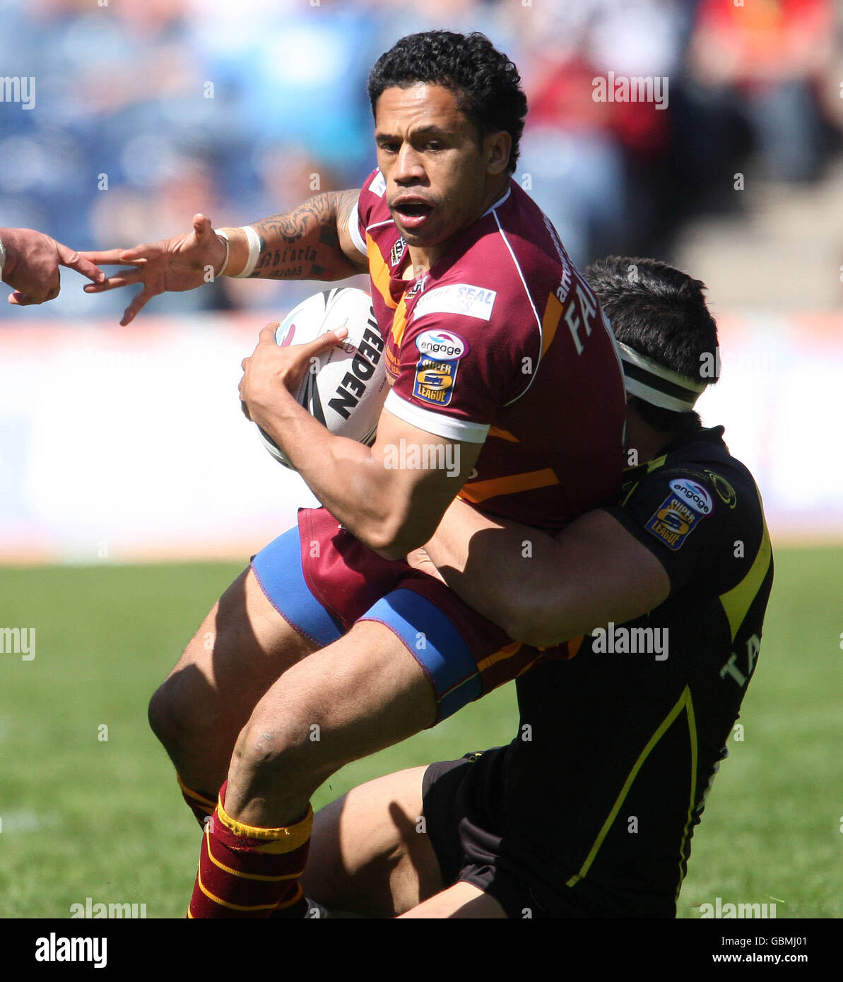 Huddersfield's David Faiumu is stopped by Celtic Crusaders' David ...