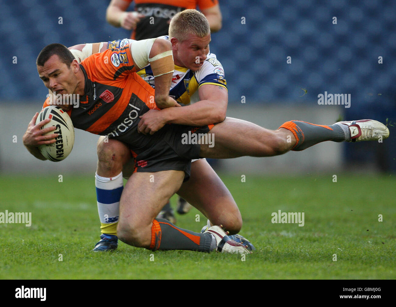 Hull KR Daniel Fitzhenry and Warrington's Michael Cooper during the ...