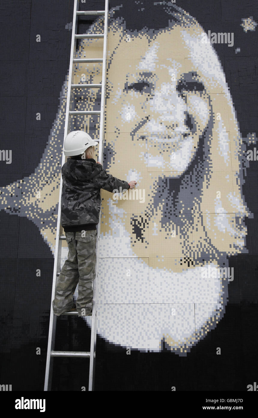 Alex Lindsey, 11, from Woolwich places the last of 48,000 Lego bricks ...