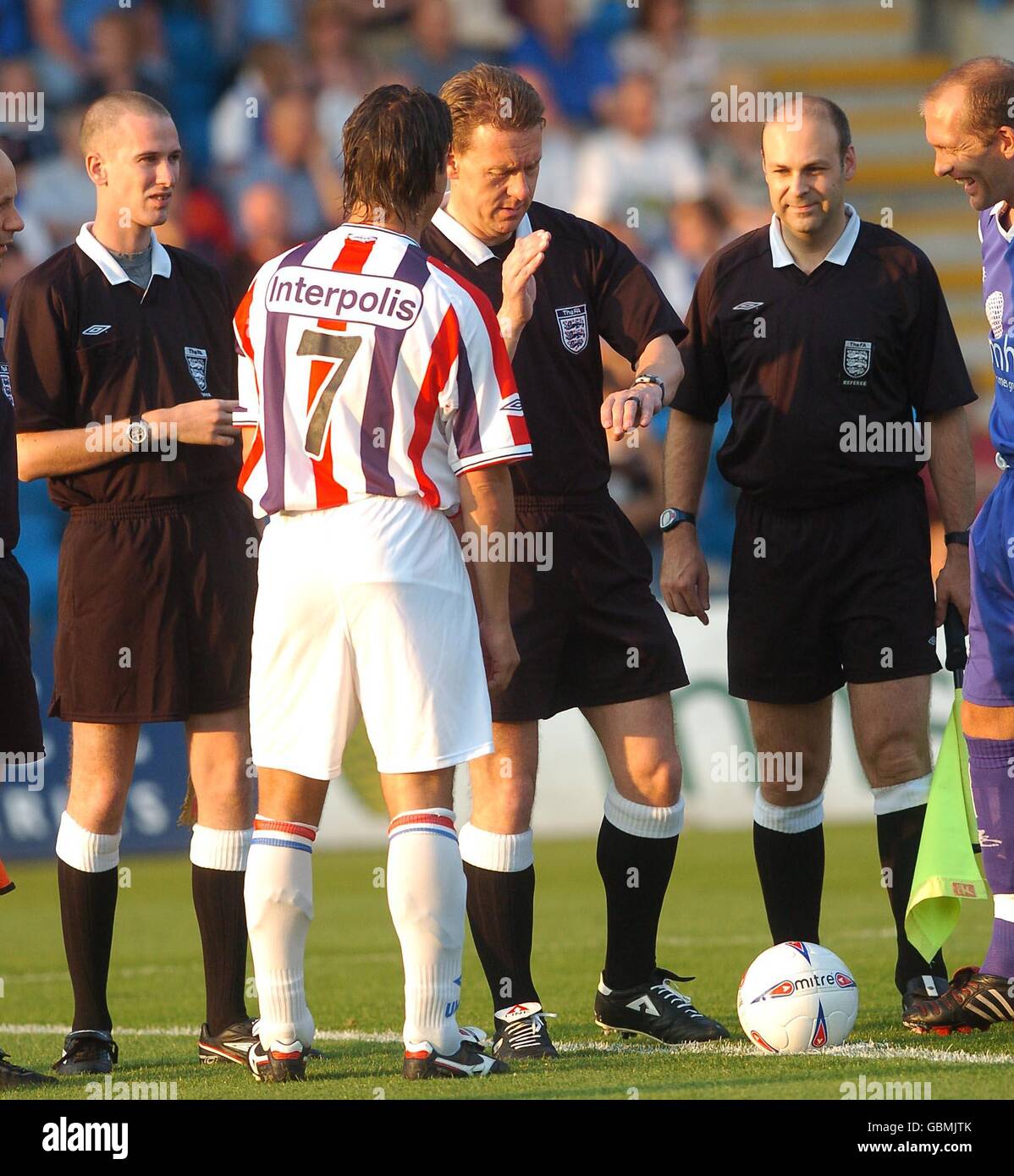 Jonathan Gooding (l) the fourth official with referee Paul Taylor ...